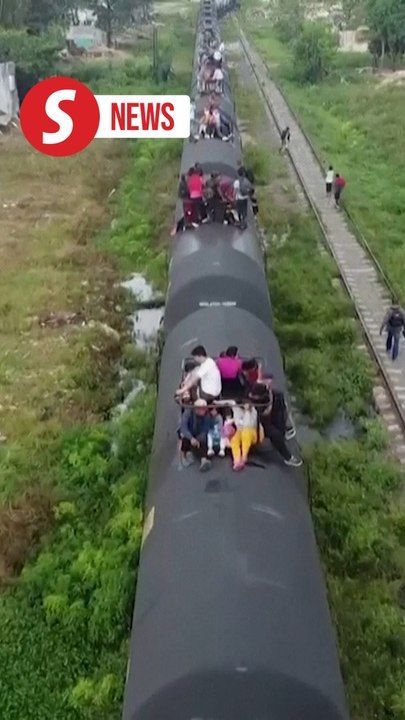 Migrant families risk life and limb to jump Mexico train in trek to ...
