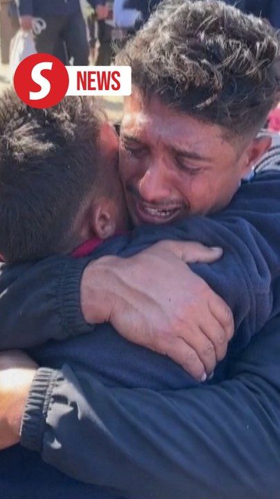 Palestinian twins share emotional embrace after a year apart ...