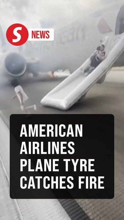 Moments of evacuation from American Airlines plane tyre fire ...